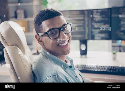 Portrait Of Young Nerd Guy Hacker Sitting Leather Armchair When Fixing
