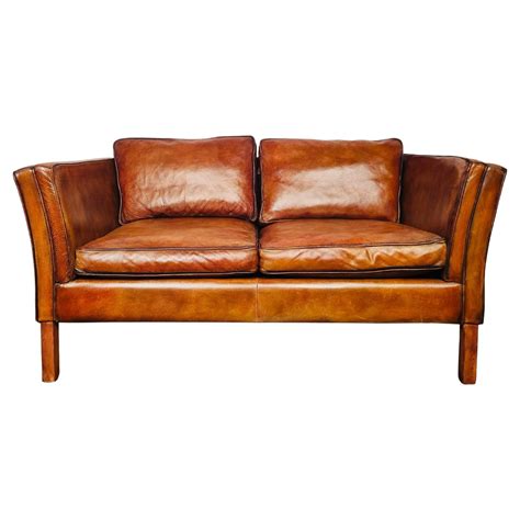 Stylish Neat Light Tan Leather Two Seater Sofa Mahogany Brass Capped