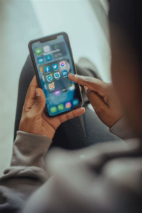 An Iphone With Multiple Different Types Of App Icons Is Shown In The Image Editorial Image