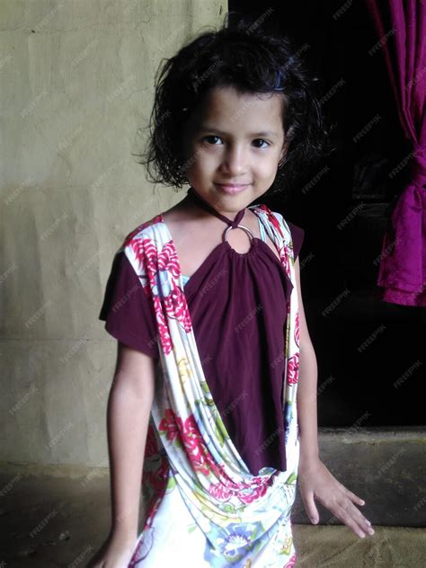 Premium Photo Portrait Of Cute Girl Standing At Home