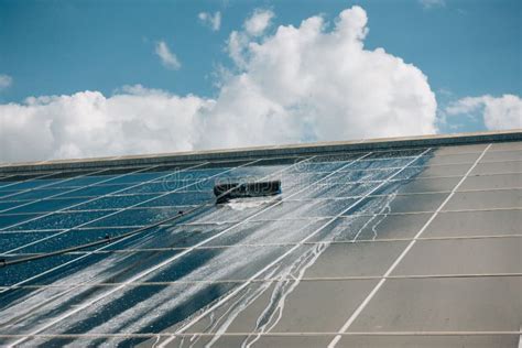 close up shot of solar system panel cleaning process stock image