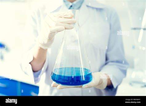 Female Researcher Holding Flask With Chemical Liquid Stock Photo Alamy