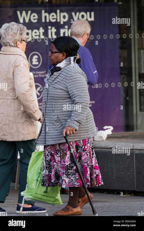 Old Woman Walking With Cane