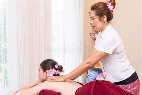 Thai Massage Therapist Is Massaging A Woman Back Stock Image Image Of