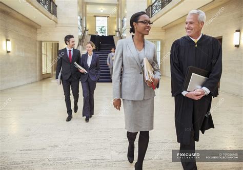 Judges And Lawyers Walking Through Courthouse — Power Judgment Stock