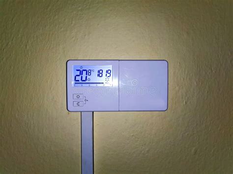 Thermostat White Controlling The Heating With A Digital Display On
