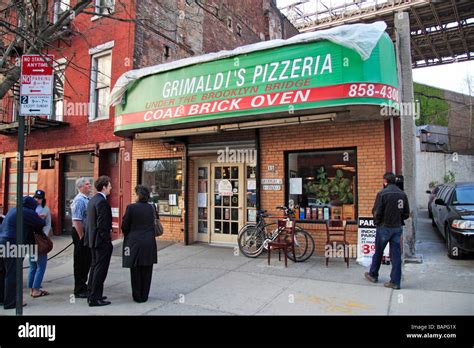A Queue Outside The Popular Grimaldis Pizzeria Under The Brooklyn