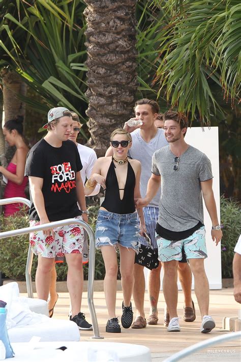 Miley Cyrus At A Pool In Miami With Her Boyfriend December 2014
