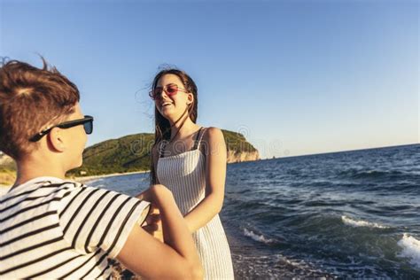 Brother And Sister Are Having Fun On The Beach Stock Image Image Of