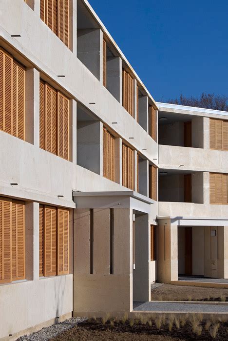 Social Housing With Solid Stone Walls By Perraudin Architecture