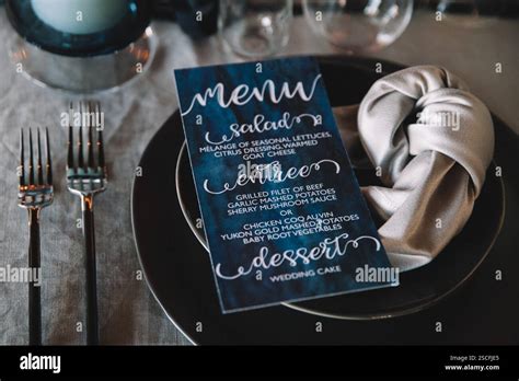 A Beautifully Arranged Table Showcases An Elegant Wedding Menu