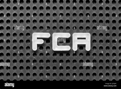 White Alphabet Letter In Word Fca Abbreviation Of Free Carrier On Black Pegboard Background