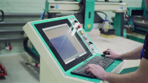 A Male CNC Machine Operator Is Typing On The Control Panel Stock Footage Video Of Technology