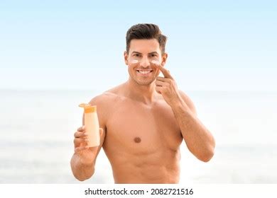 Handsome Man Applying Sunscreen Photos And Images Shutterstock