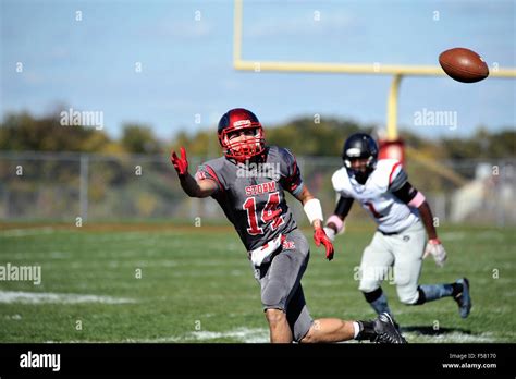 Pass Receiver Working On An An Out Route In An Effort To Make A Reception In Front Of An