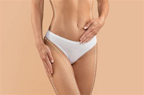 Body Shaping Female In White Panties With Drawn Outbound Lines On Skin