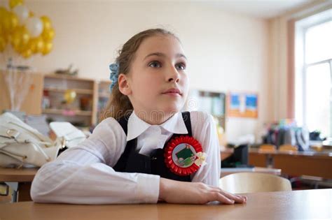 Pretty School Girl In Uniform Sits At Desk In Stock Image Image Of