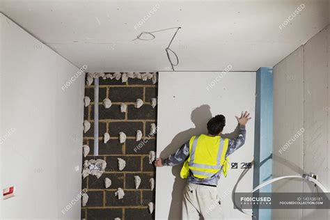 Building Worker Fitting Plasterboard Protective Workwear New Build Stock Photo