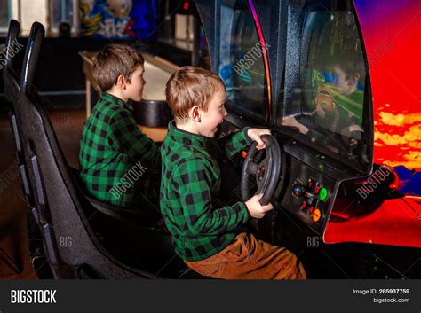 Man Playing Arcade Car Game