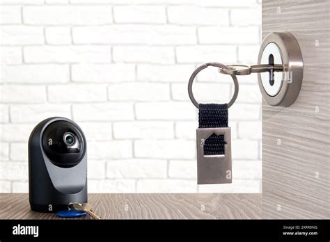 Opened Door With Key And IP Camera On The Table Control Your House Access Stock Photo Alamy