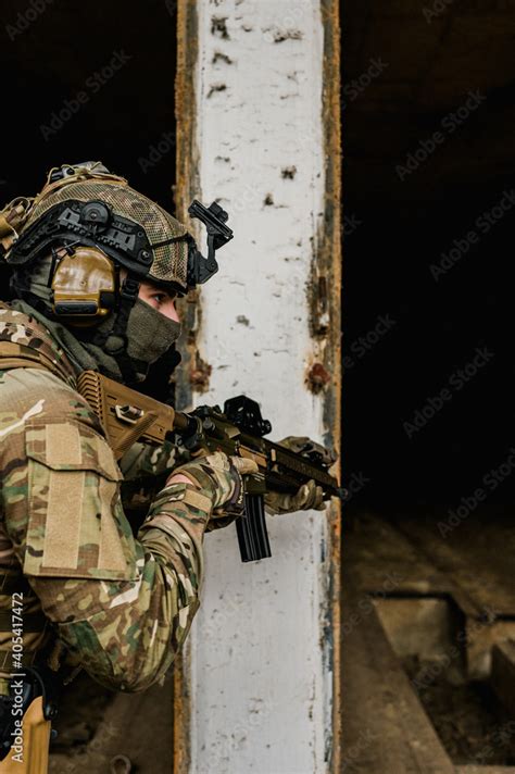 Special Forces Soldier Doing Tactical Training In Building Clearing