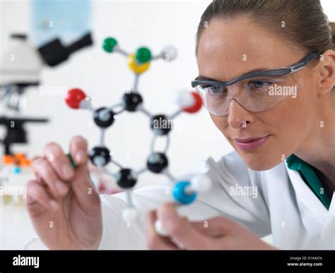 Female Scientist Looking At A Molecular Model Stock Photo Alamy