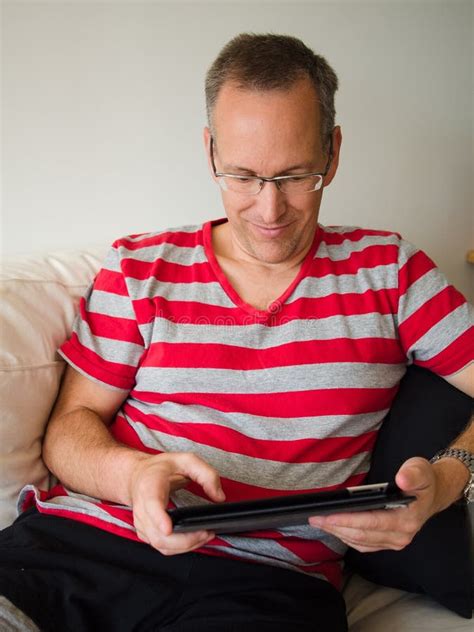 Man With On A Tablet Stock Image Image Of Reading Couch