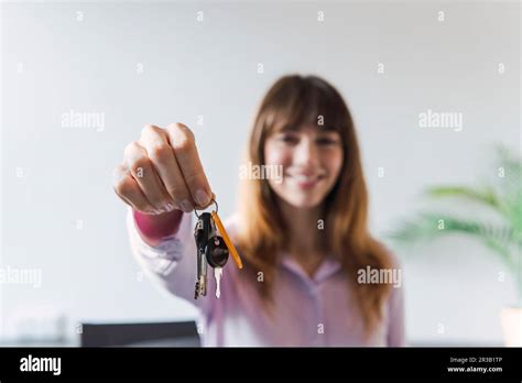 Woman Giving House Keys In Office Stock Photo Alamy