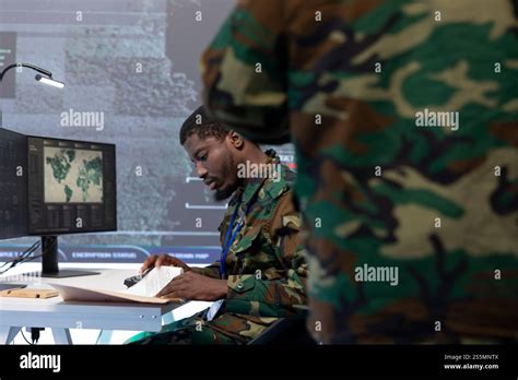 Military Officer Oversees Surveillance And Cybersecurity Operations In A High Tech Army Command