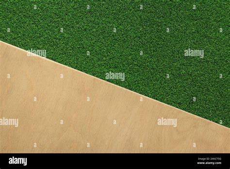 Green Artificial Grass Rug On A Wooden Background Artificial Grass