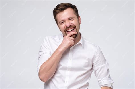Premium Photo Happy Smiling Guy With Beard Looking At Camera