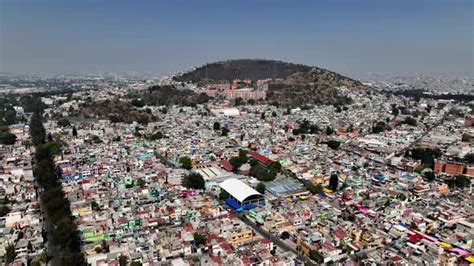 Ghetto Neighborhood And A Old Volcano Crater In Sunny Iztapalapa