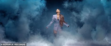 Ariana Grande Flashes Legs As She Swings Through Heavenly Landscape In