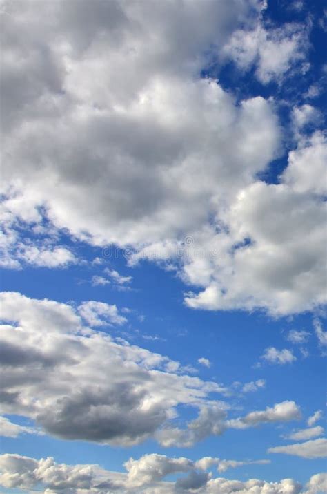 A Blue Cloudy Sky With Many Small Clouds Blocking The Su Stock Image