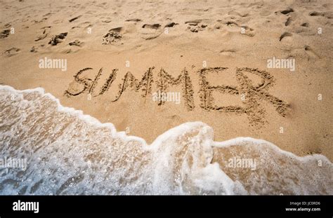Word Summer Written On Wet Sand At Seashore Stock Photo Alamy