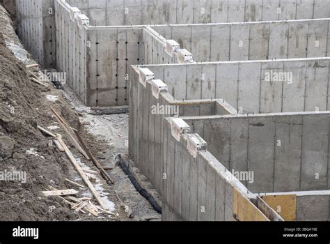 Concrete Walls Of Basement Foundation With Weeping Tile At A