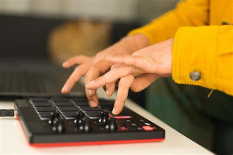 Premium Photo The Hands Of A Man Making Beats On His Mpd Midi Controller Premium Photo The Hands Of A Man Making Beats On His Mpd Midi Controller