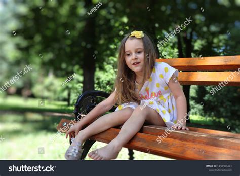 Girl Sitting Down On Bench