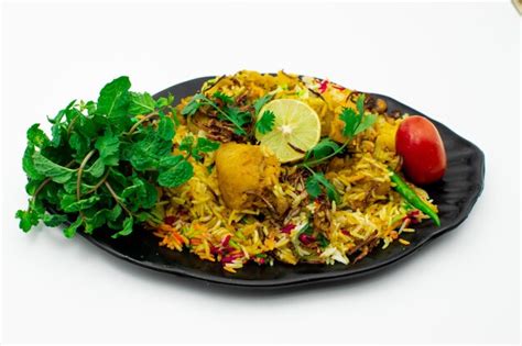 Premium Photo Isolated Delicious Spicy Chicken Biryani In Black Plate