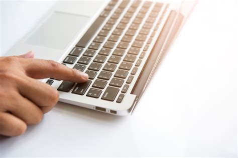 Premium Photo Male S Finger Pushing Enter Button On Laptop Keyboard