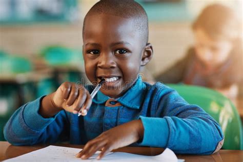 Hes All Smiles When Hes Doing His Work Cropped Portrait Of An