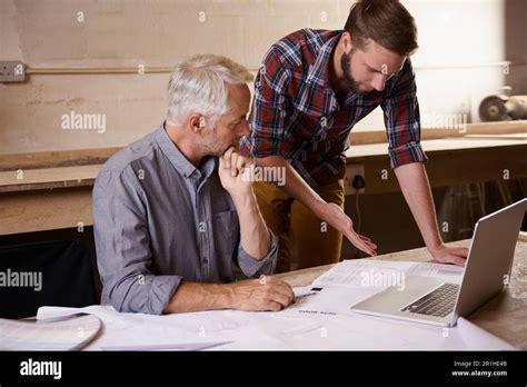 Architecture Collaboration And Father And Son With Blueprint In Workshop For Building