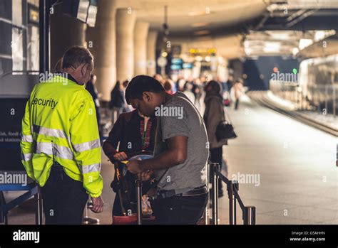 Custom Security Checking Passport On A Tourist Due To Conflicts In