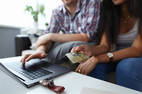 Premium Photo Couple Enters Credit Card Information On Internet