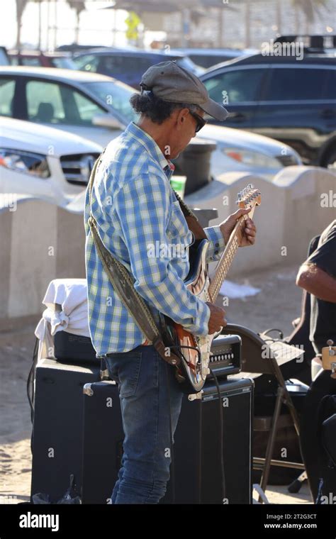 A Photo Of An Old Non Recognizable Man Playing A Guitar On The Sidewalks Of Venice Beach Stock