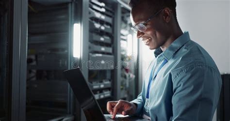 Happy Man Engineer And Laptop In Server Room For Database Update