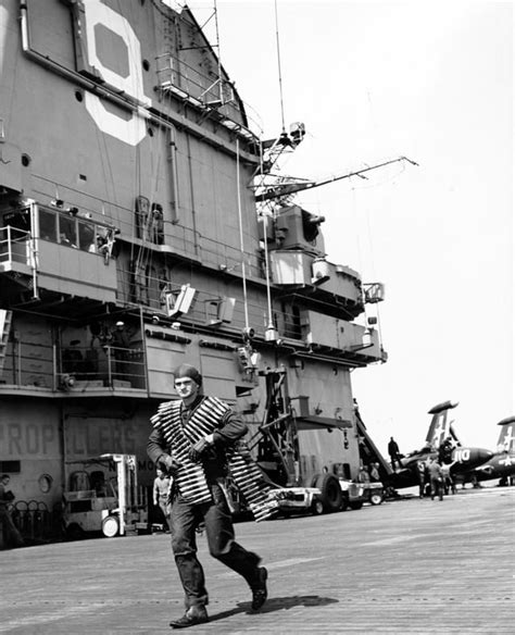 Aboard Uss Essex Cva 9 Seaman Leroy Kellam Weighed Down With Belts Of 20 Millimeter Cannon