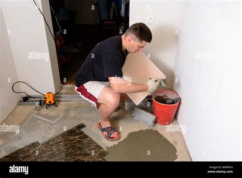 The Master Tile Smears The Mucilage Solution On The Marble Tile 2018