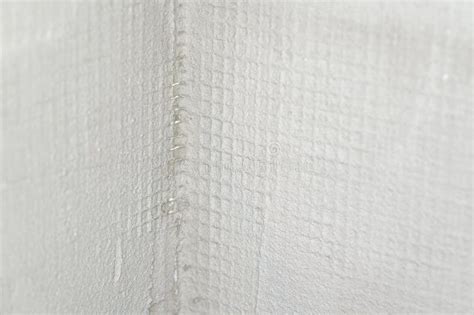 Bare Wall In New House Construction Site With Plastic Reinforcement Net