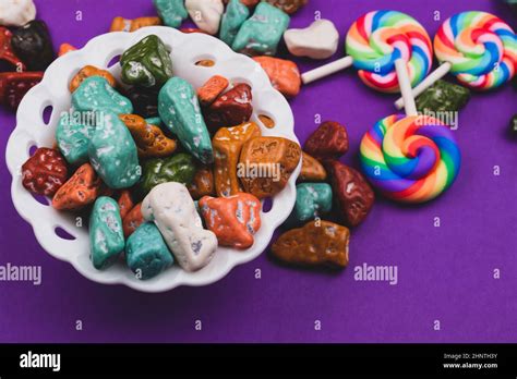 Lollipops And Candy Pebbles Sweets In The Form Of Colored Stones